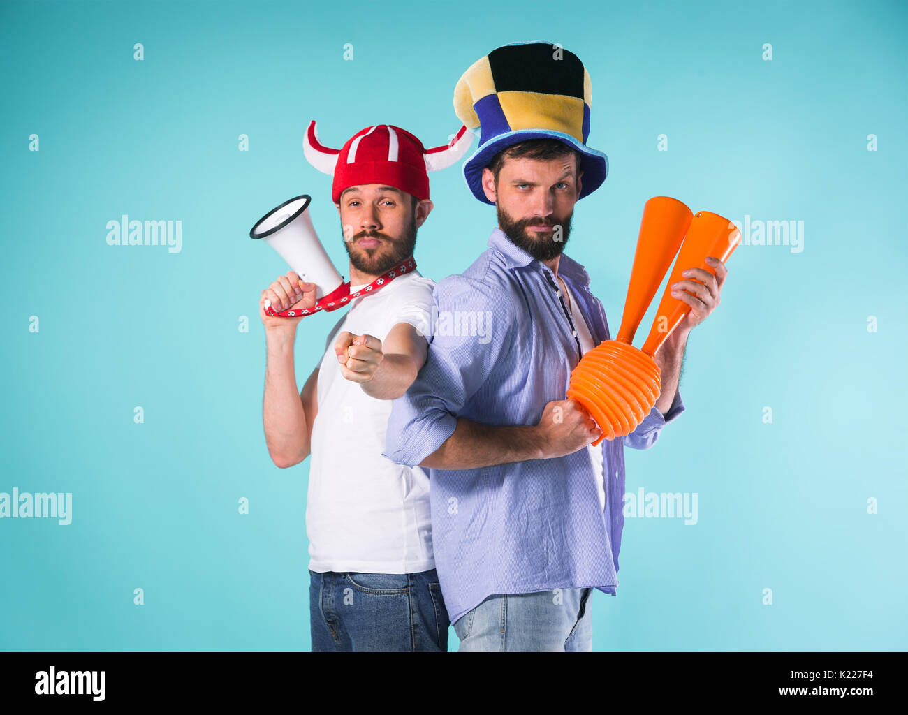 The two football fans over blue Stock Photo - Alamy