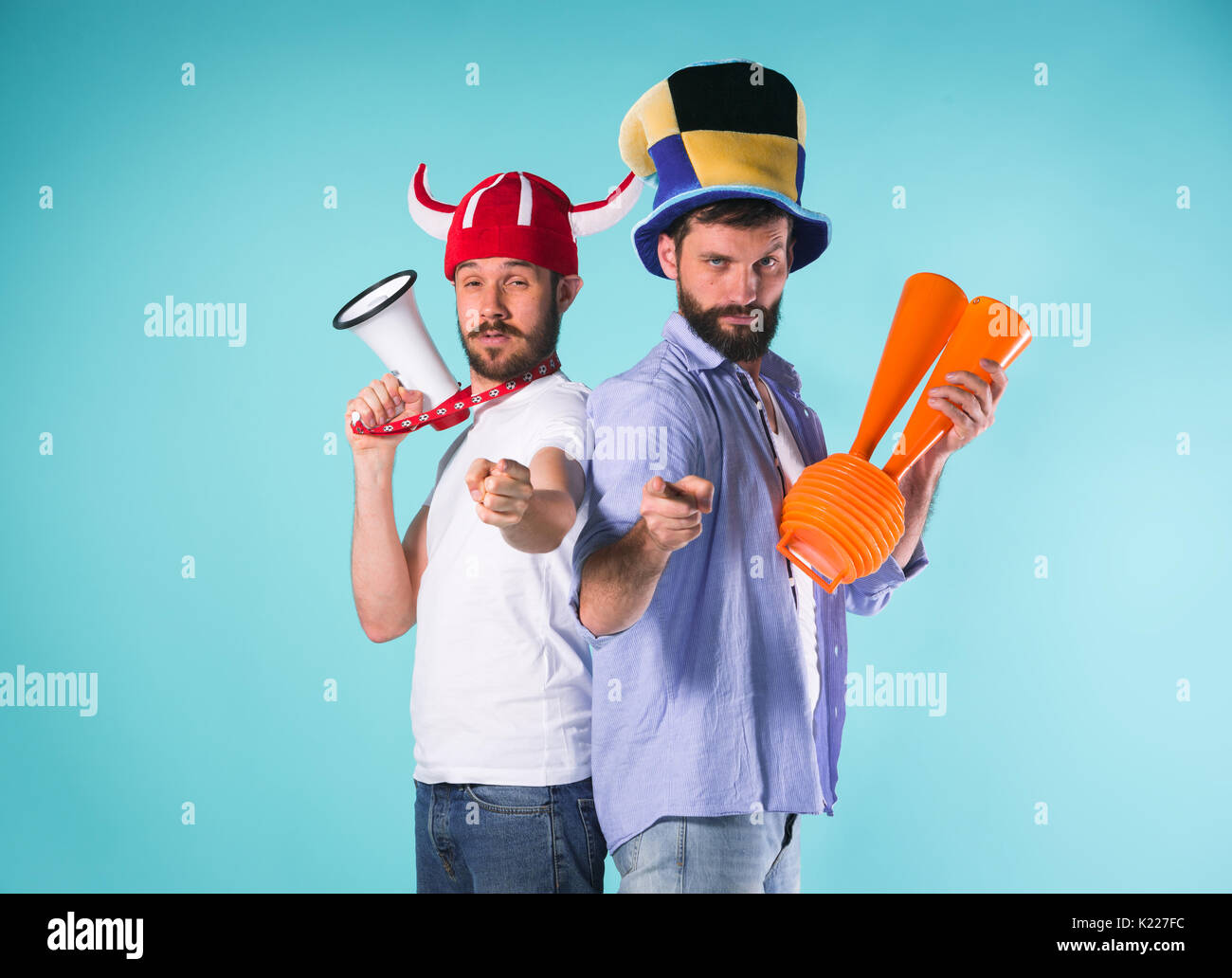 The two football fans over blue Stock Photo - Alamy