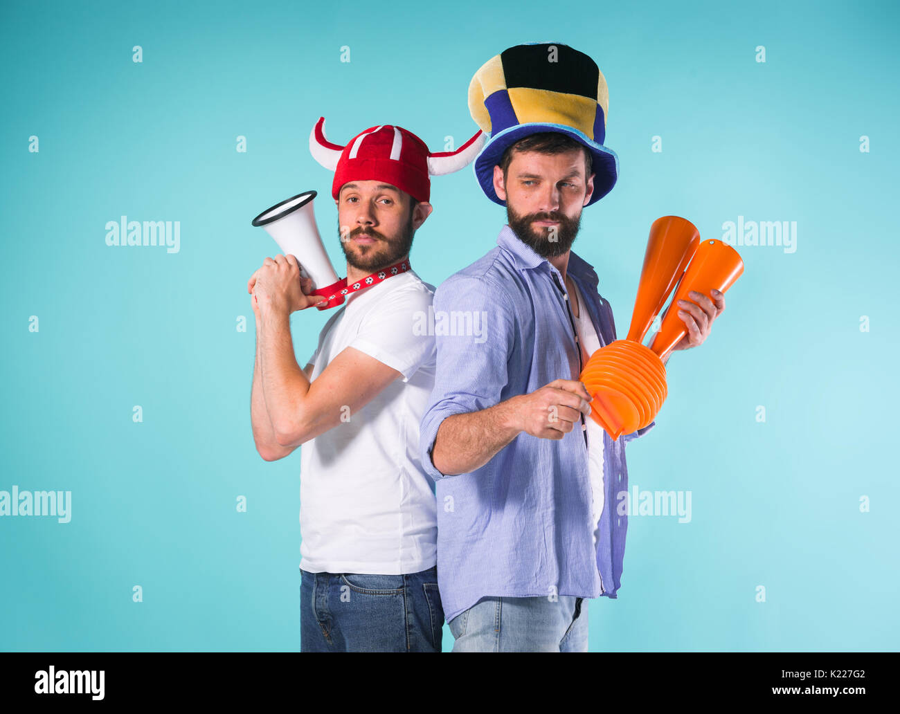 The two football fans over blue Stock Photo - Alamy