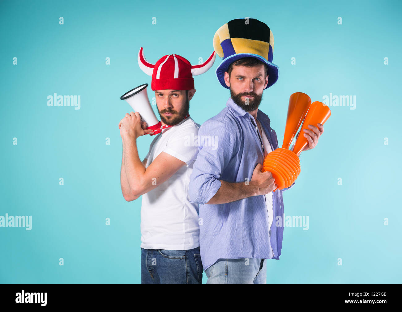 The two football fans over blue Stock Photo - Alamy