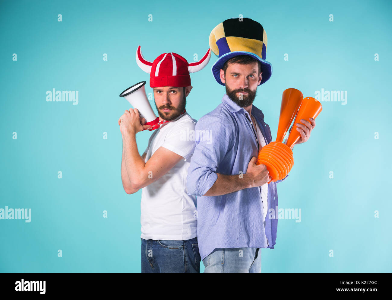 The two football fans over blue Stock Photo - Alamy