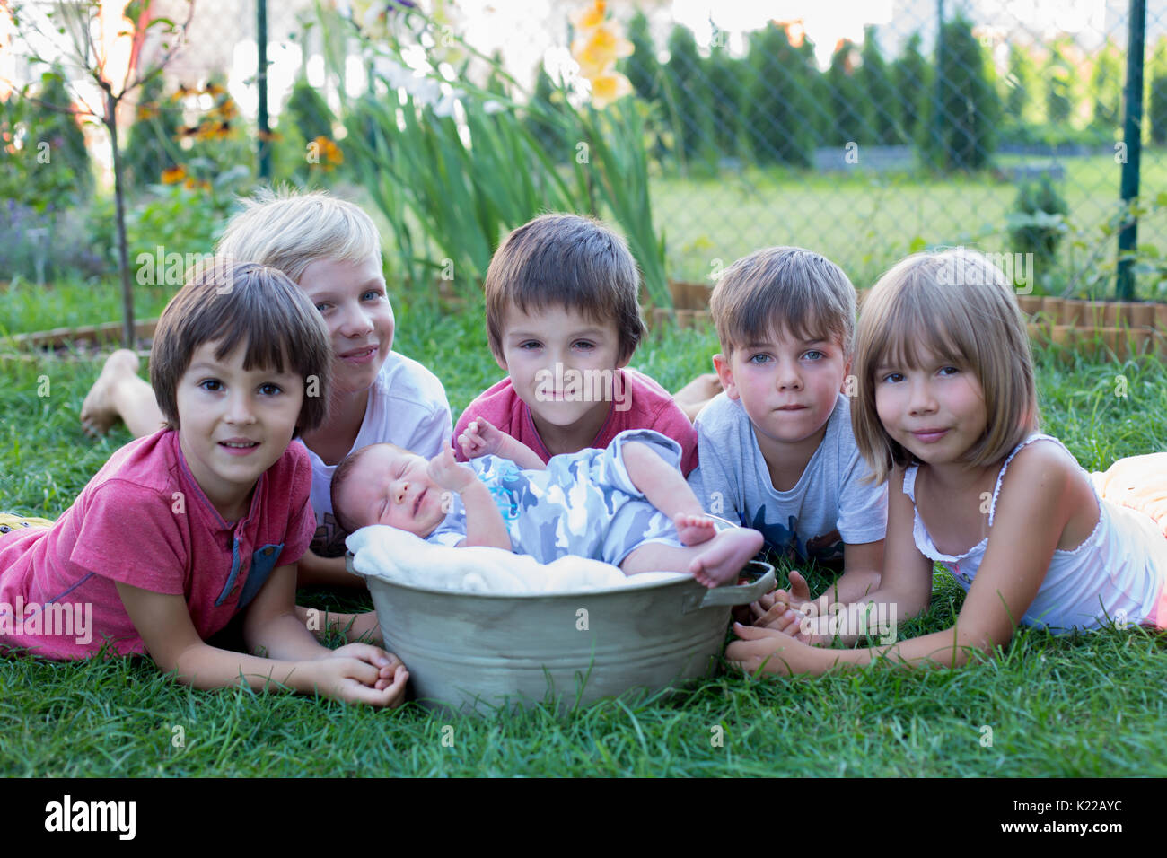 Group happy kids laying in hi-res stock photography and images - Alamy