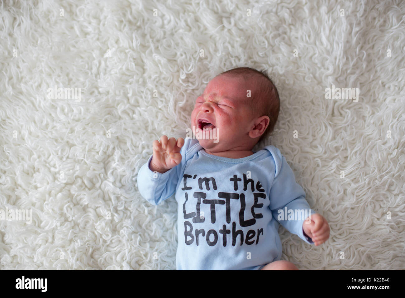 Little newborn baby crying, baby with skin rash, child dermatitis ...