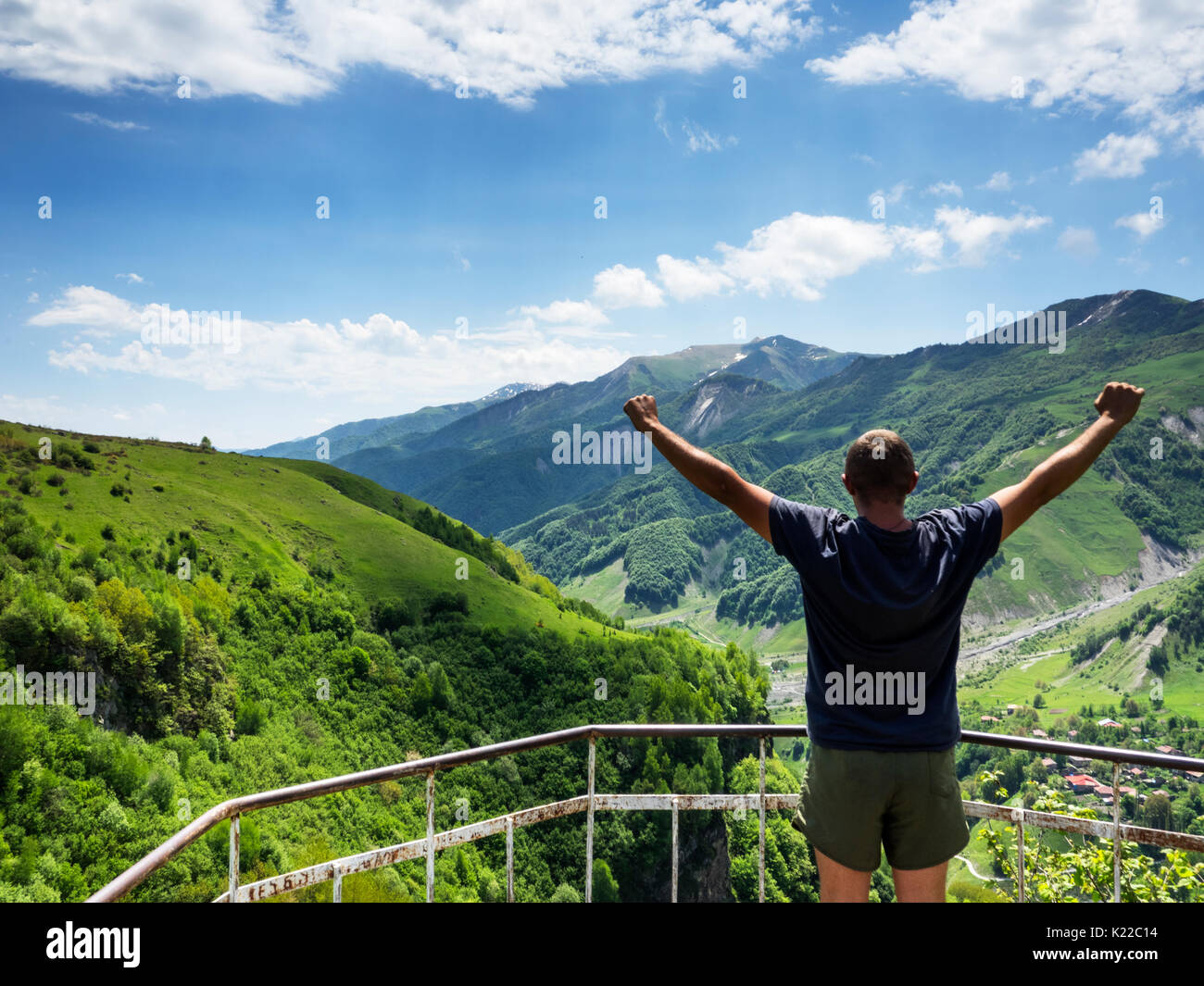 Young man standing hands up air hi-res stock photography and images - Alamy