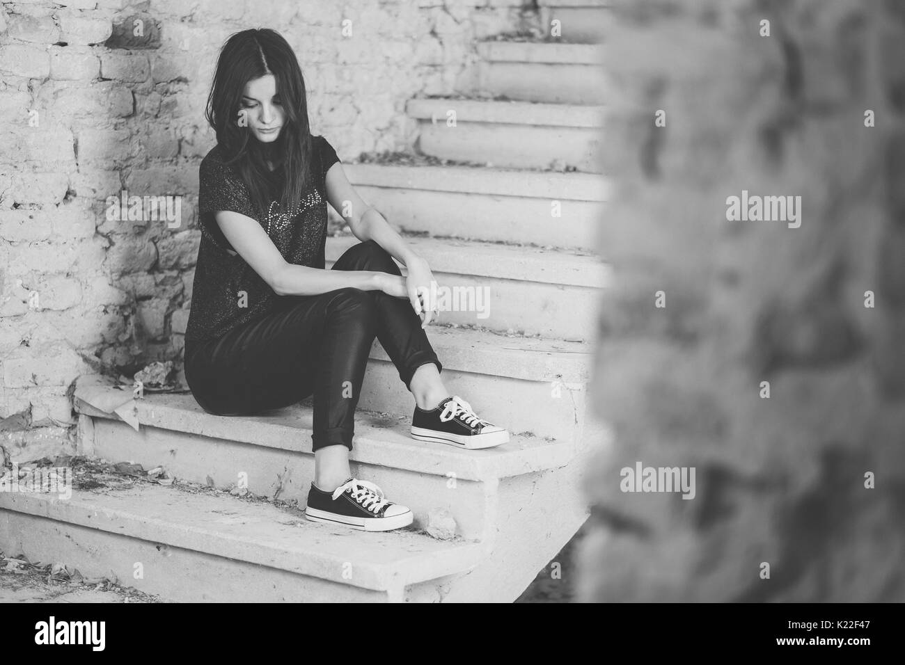 Sad depressed woman in old building Stock Photo - Alamy