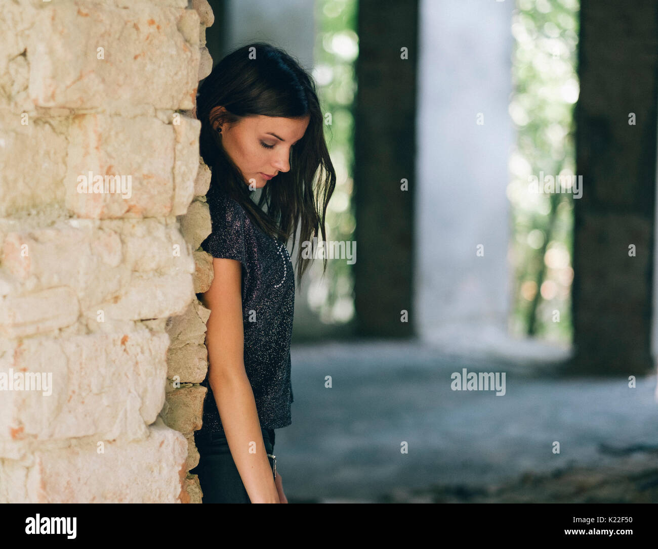 Sad depressed woman in old building Stock Photo - Alamy
