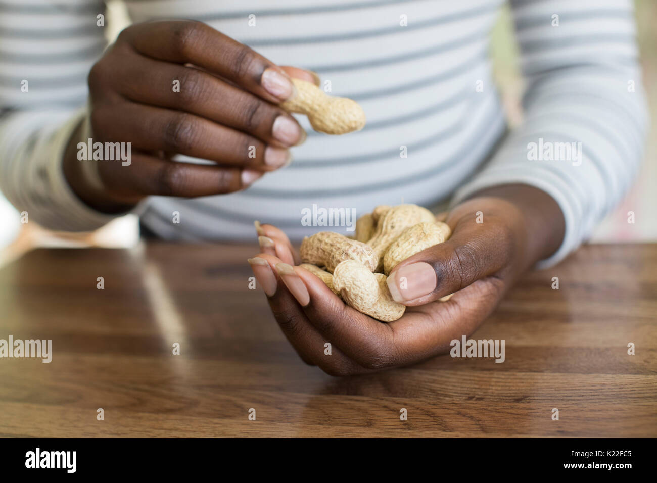 Close Up Of Teenage Girl With Handful Of Peanuts In Shells Stock Photo ...
