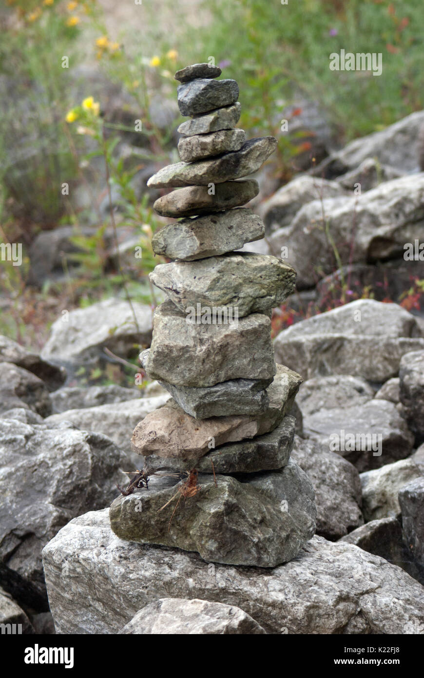 Cairn on the side of a stony path Stock Photo - Alamy