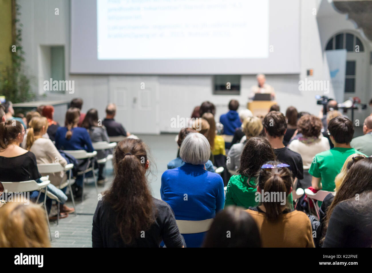 Man giving presentation in lecture hall at university Stock Photo - Alamy