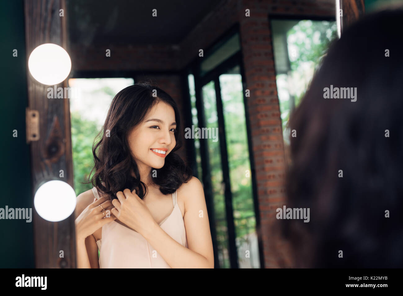 Girl looking herself mirror hi-res stock photography and images - Alamy