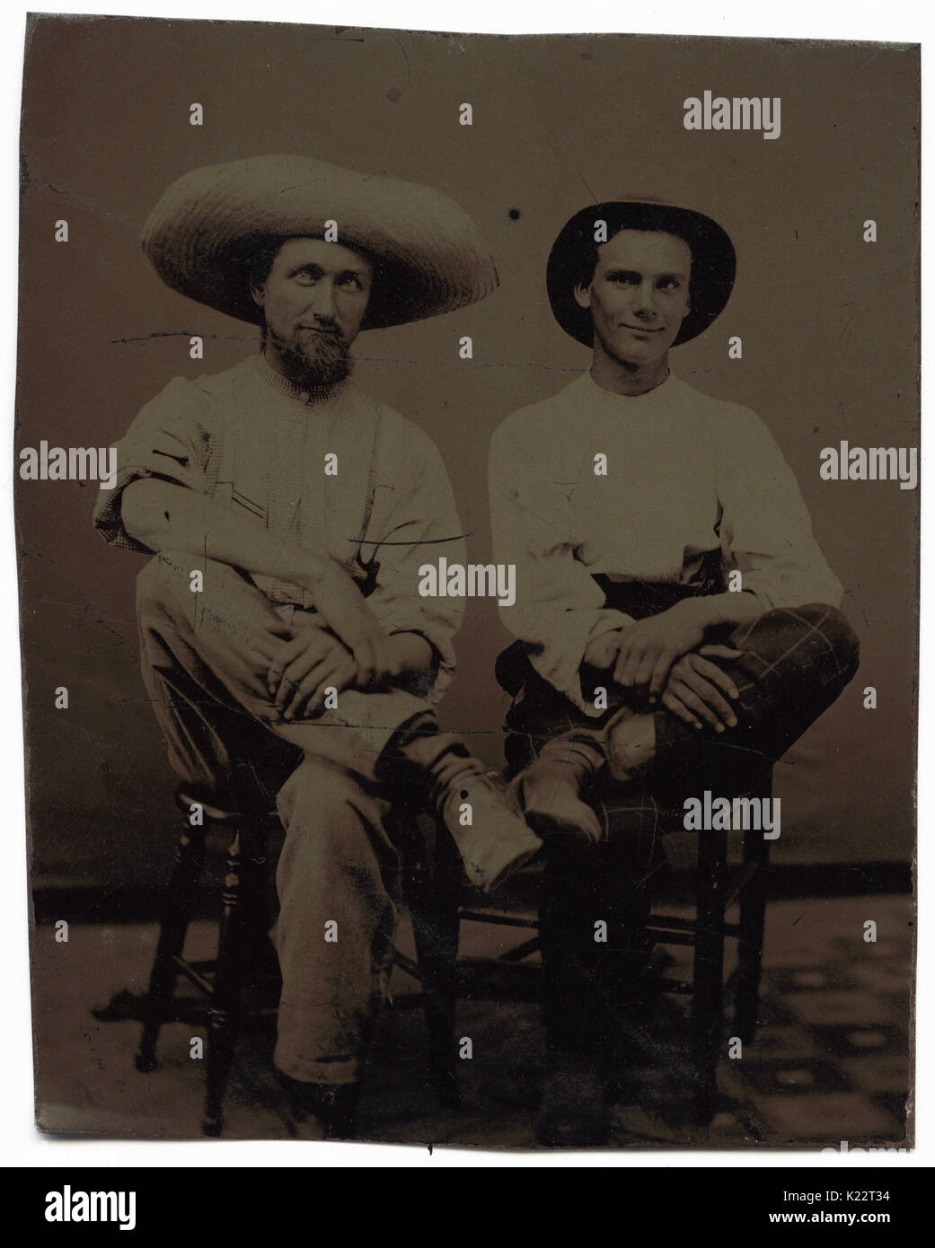 Two men, one with large straw hat Stock Photo - Alamy