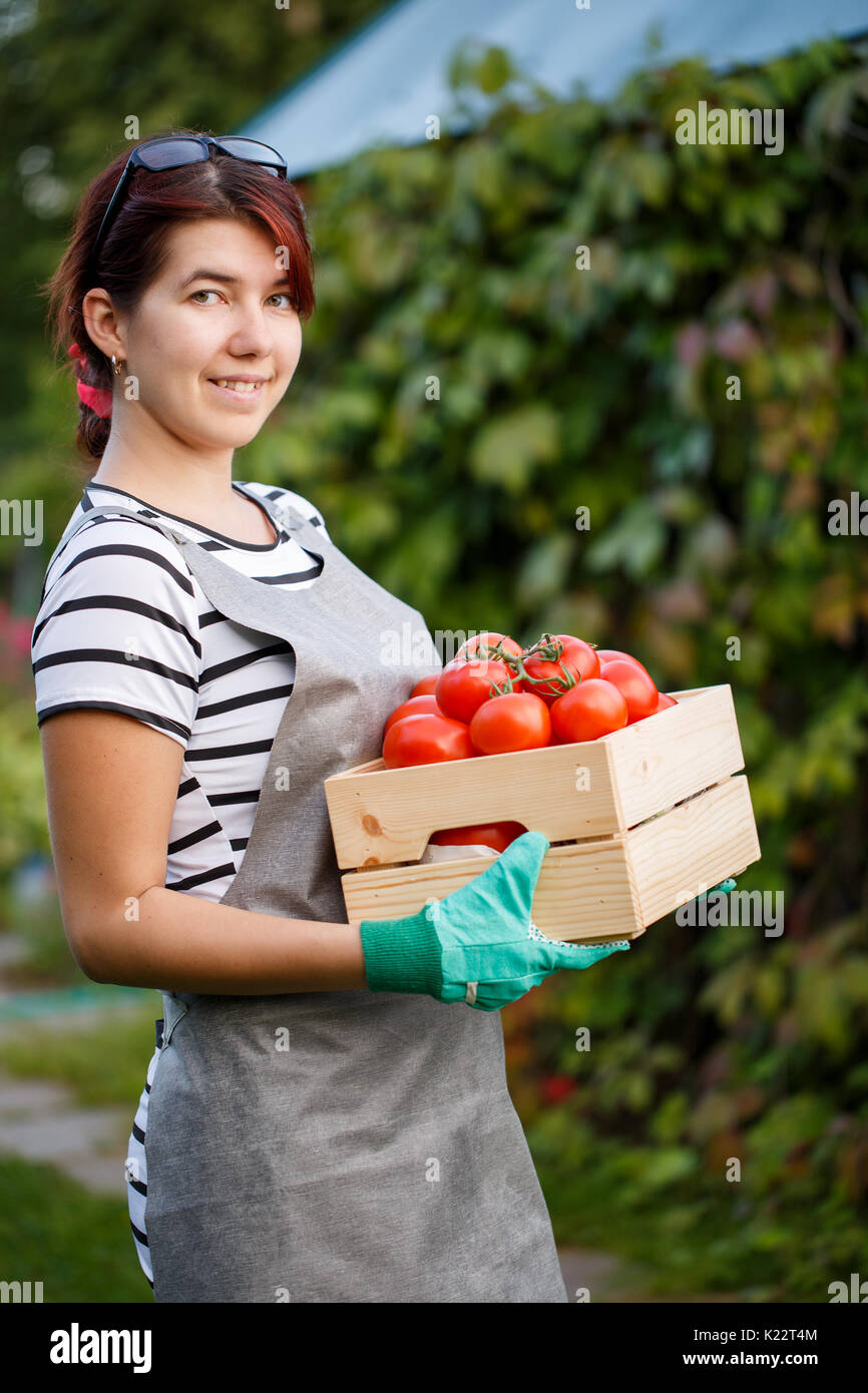 Girl gardening tomatoes hi-res stock photography and images - Alamy