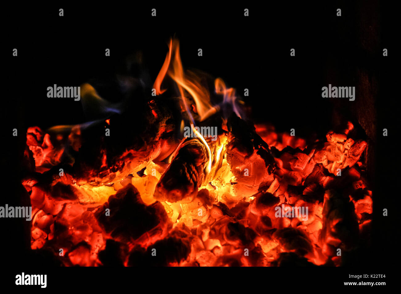 Fire burning inside a brick stove - wood, ash, flames Stock Photo - Alamy