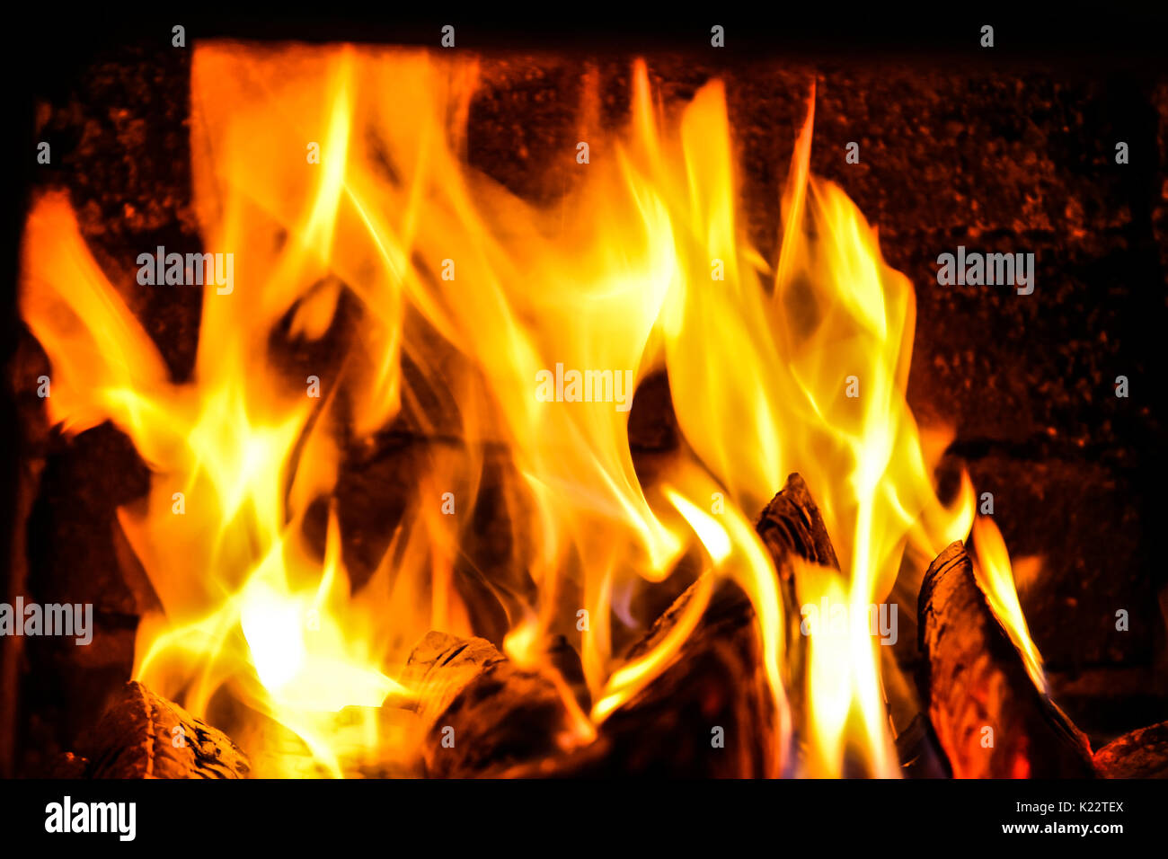 Fire burning inside a brick stove - wood, ash, flames Stock Photo - Alamy