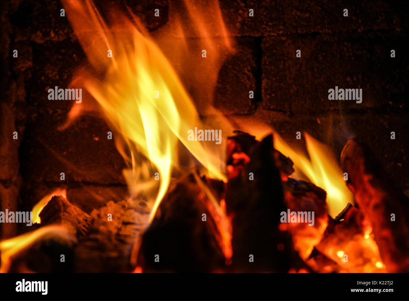 Fire burning inside a brick stove - wood, ash, flames Stock Photo - Alamy