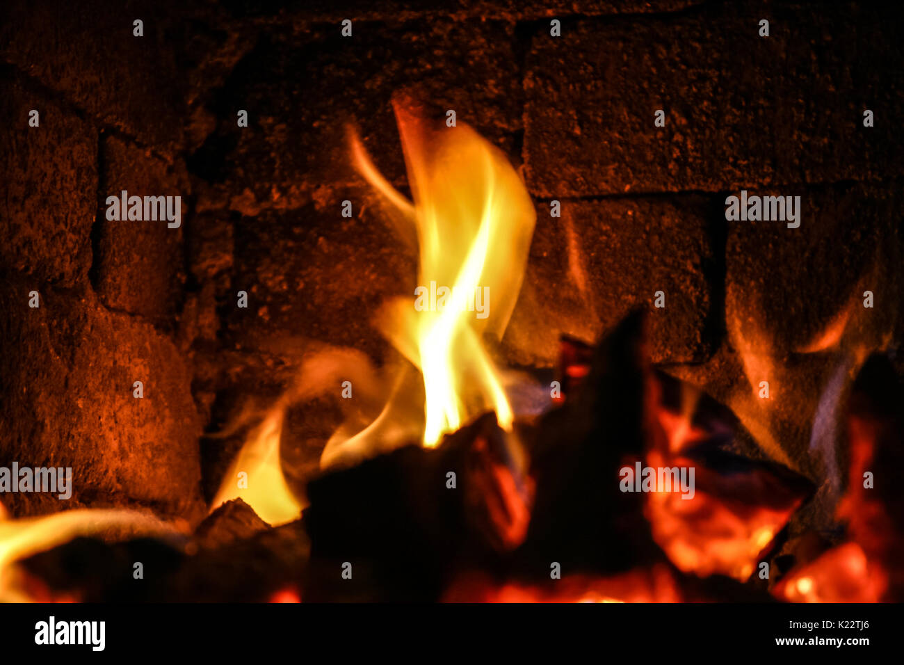 Fire burning inside a brick stove - wood, ash, flames Stock Photo - Alamy