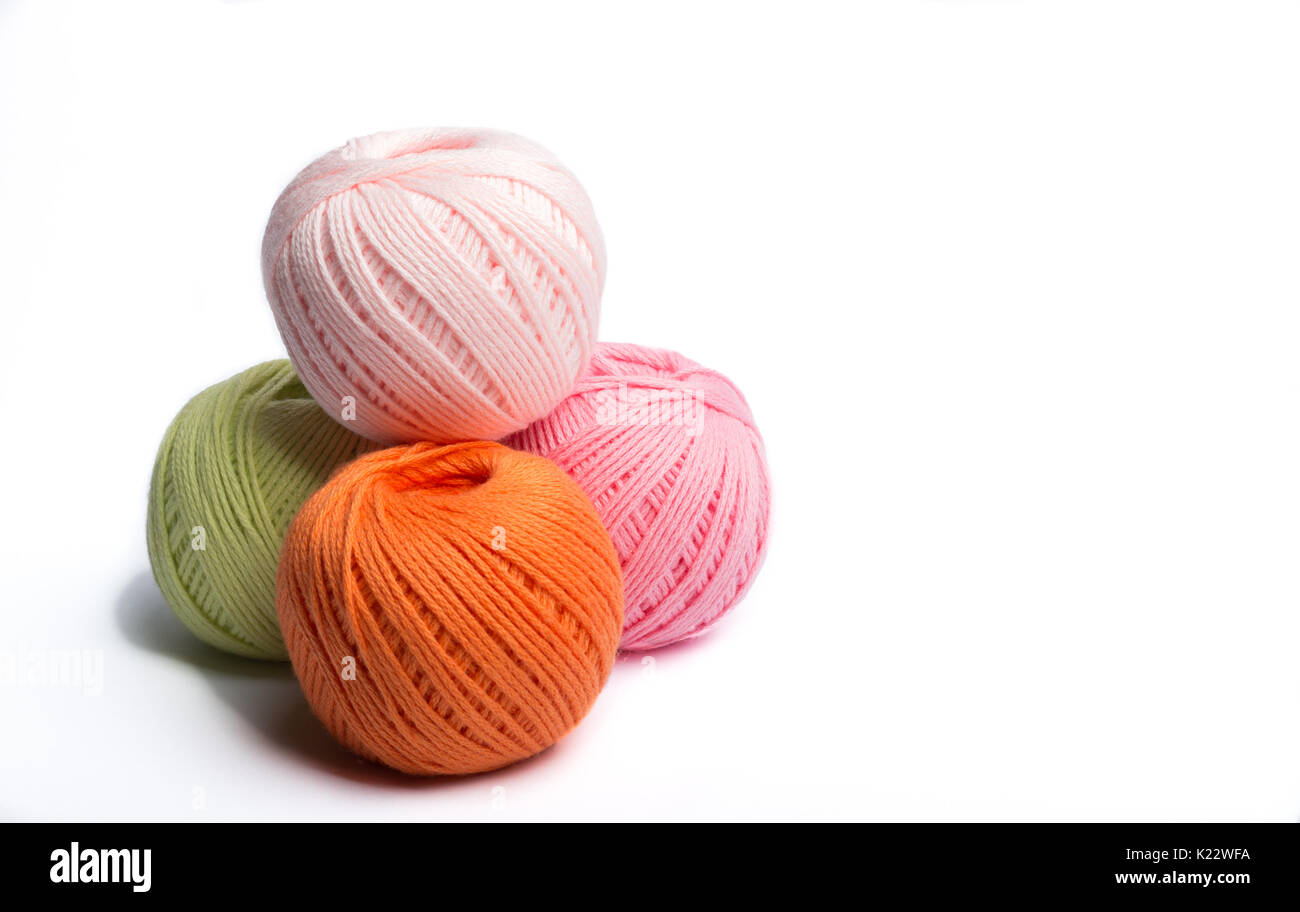 different woolen balls on a white background Stock Photo - Alamy