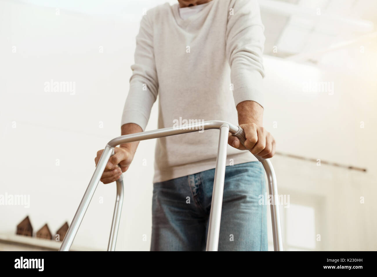 Professional walker helping the old man Stock Photo - Alamy
