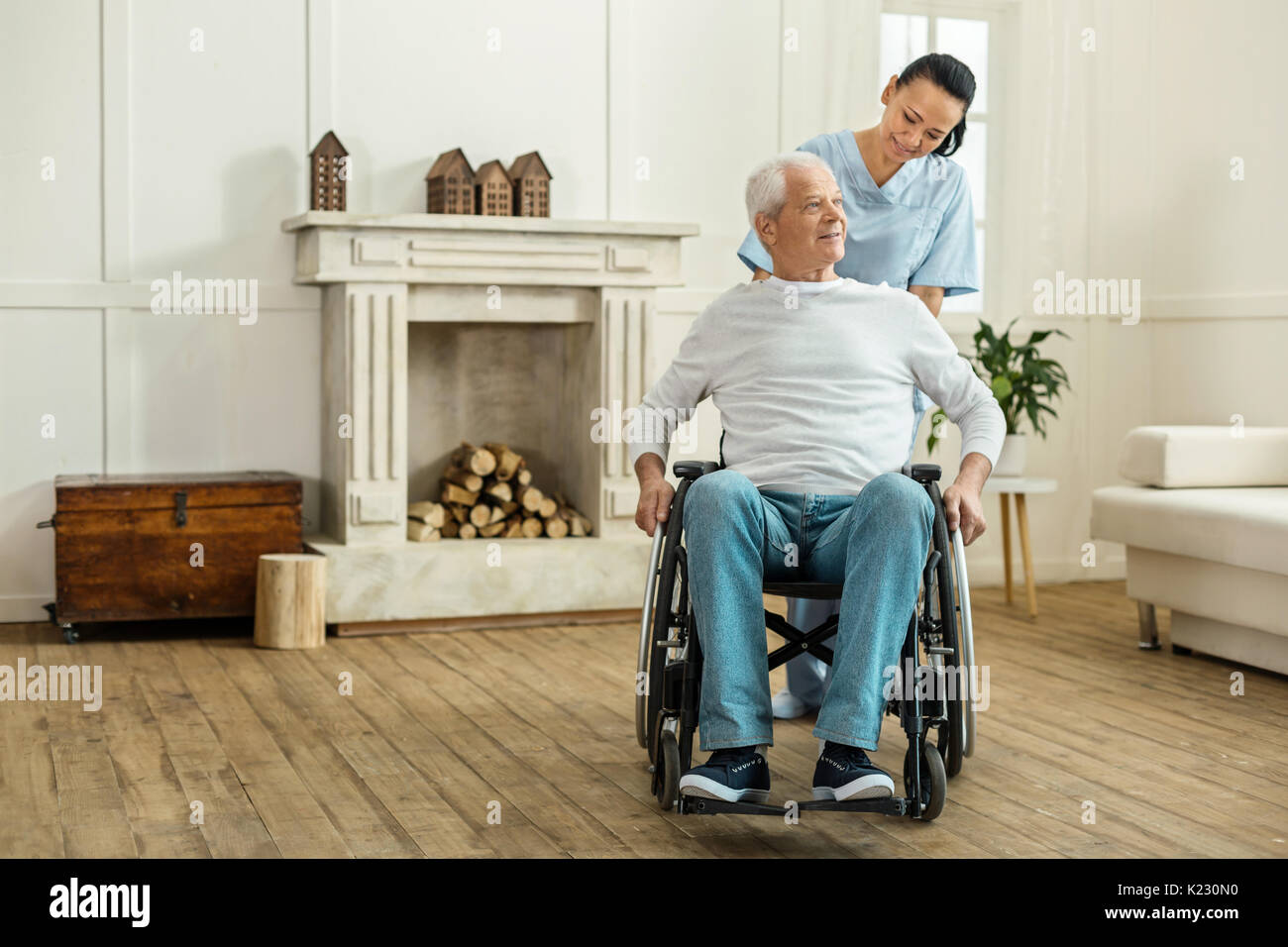 Positive nice man moving forward in the wheelchair Stock Photo - Alamy