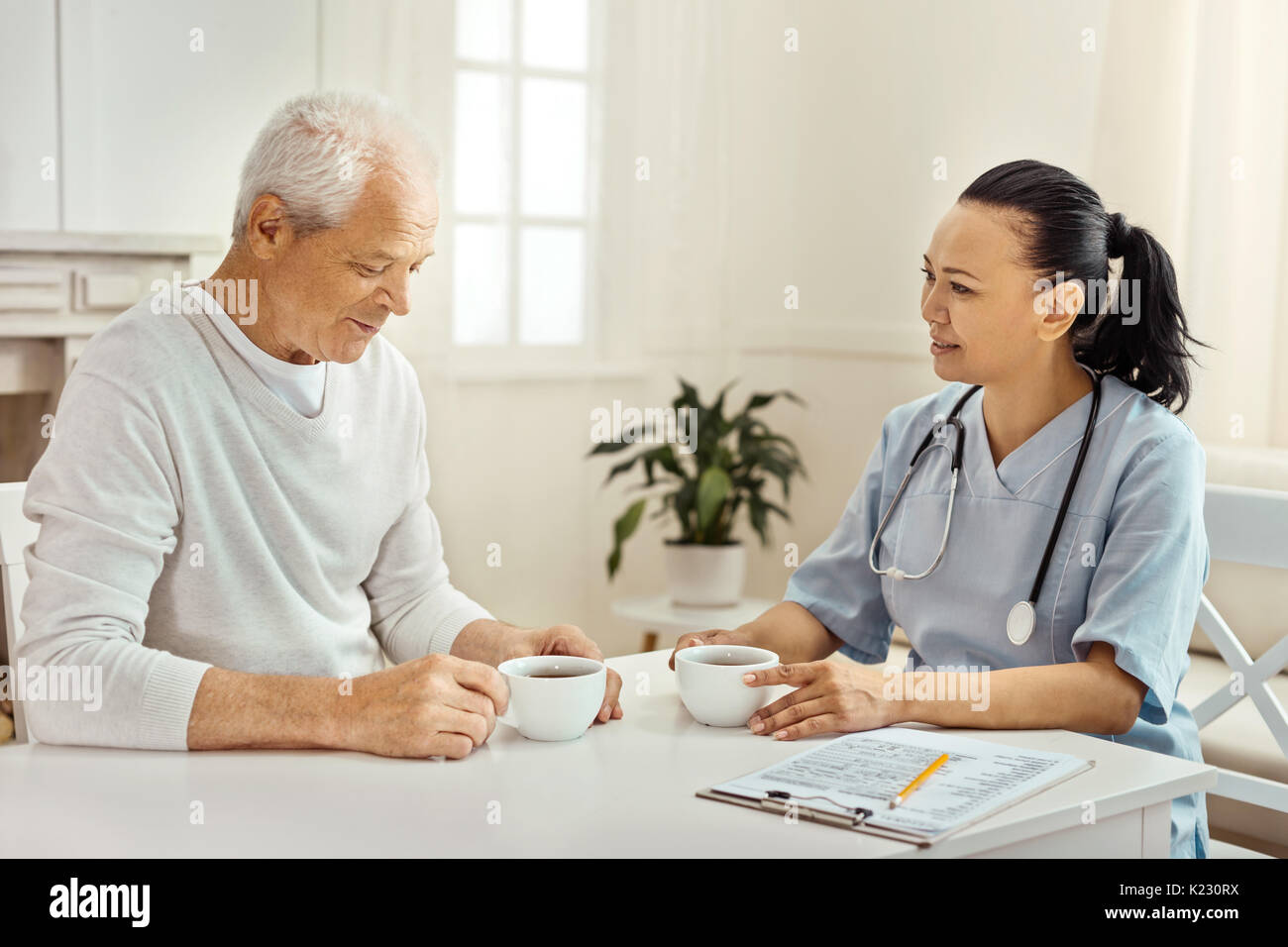 Nice elderly man telling his story Stock Photo - Alamy