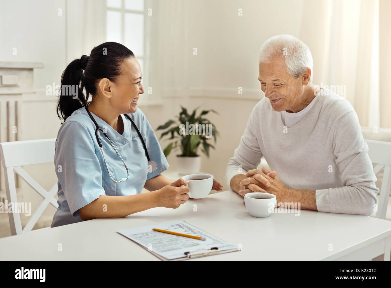 Happy joyful people having a pleasant conversation Stock Photo - Alamy