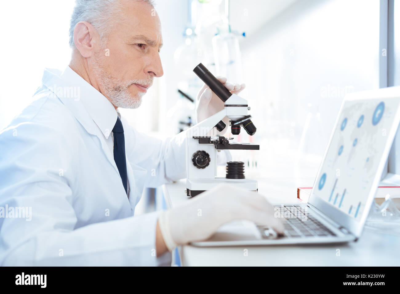 Profile picture of attentive researcher that analyzing diagram Stock ...