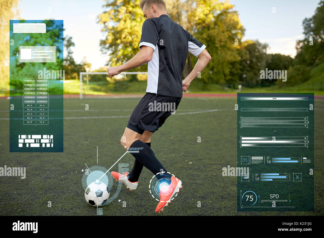 soccer player playing with ball on football field Stock Photo - Alamy