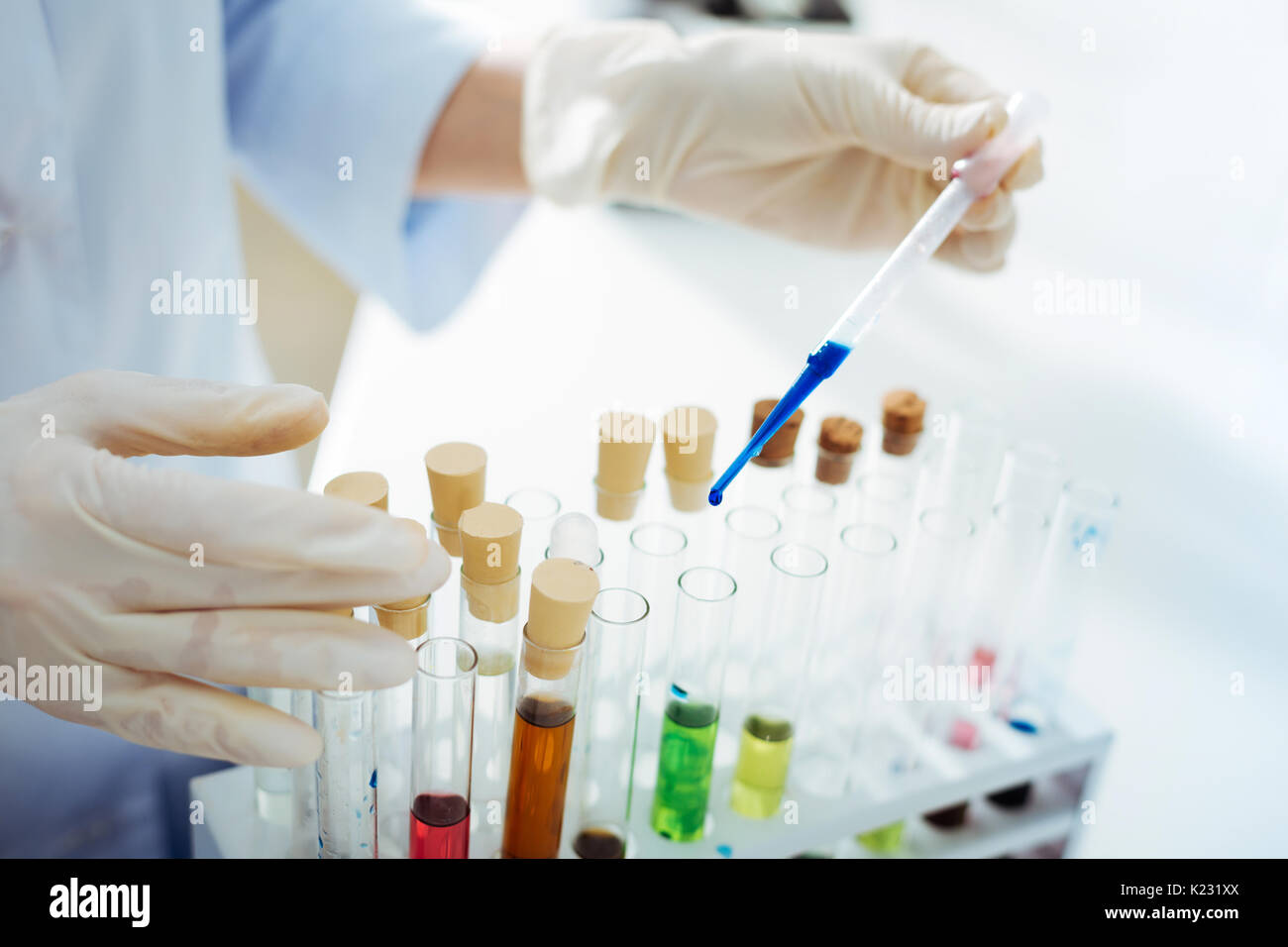 Close up of female hand that holding pipette Stock Photo - Alamy