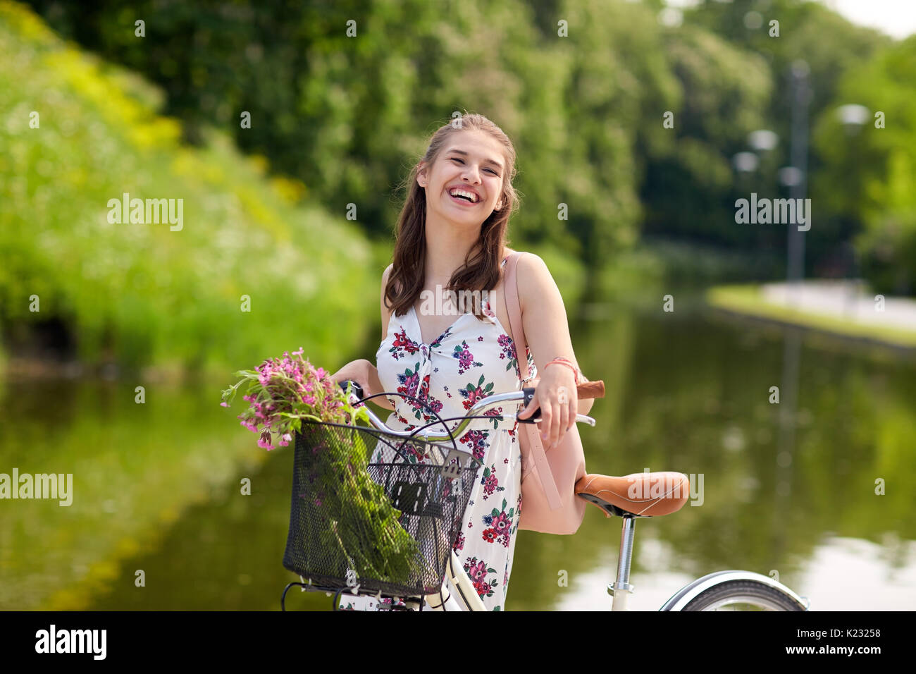 happy woman riding fixie bicycle in summer park Stock Photo - Alamy