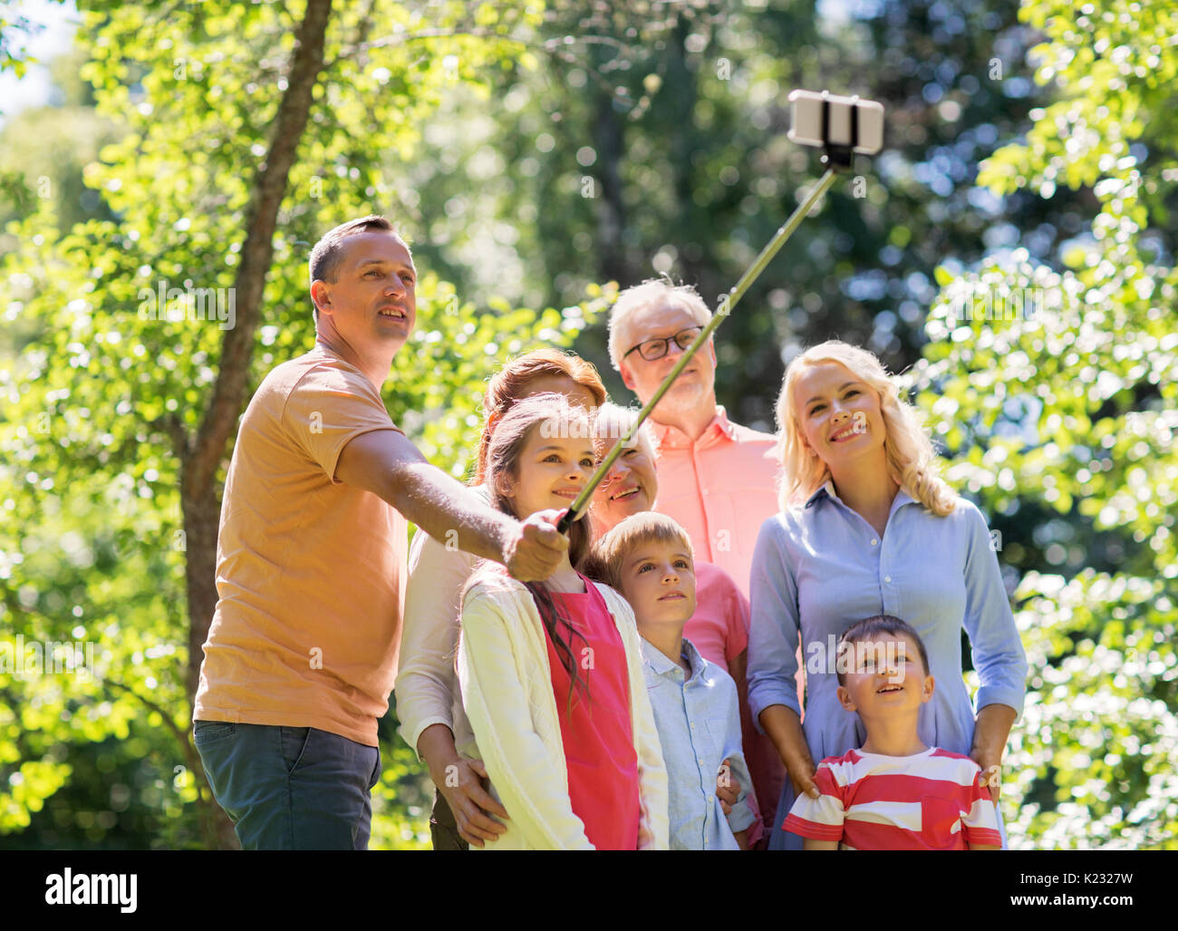 happy family taking selfie in summer garden Stock Photo - Alamy