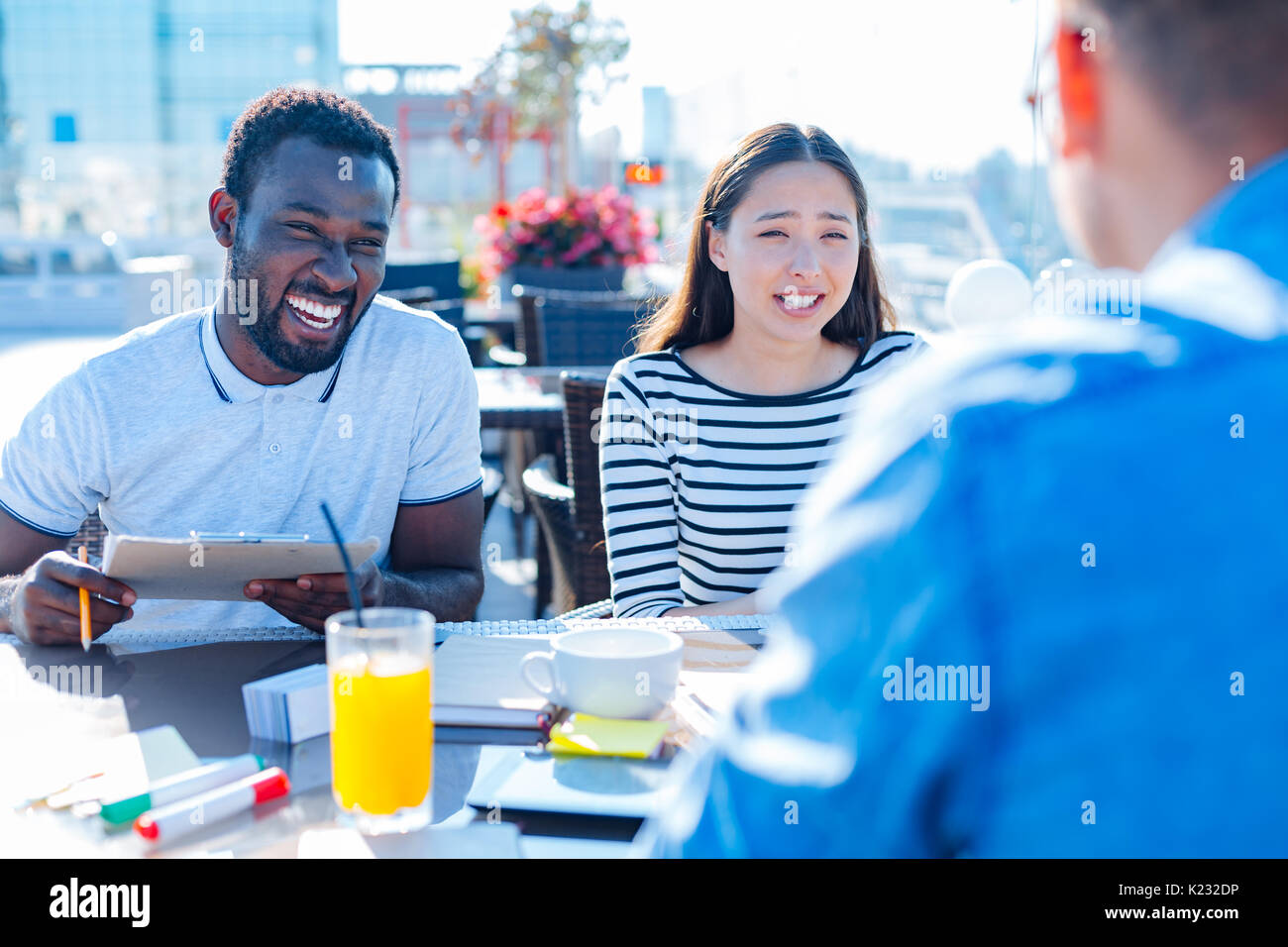 Funny freelancers laughing and joking Stock Photo - Alamy