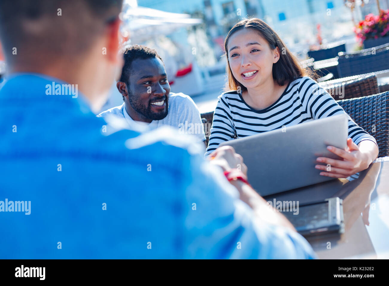 Young colleagues talking during informal meeting Stock Photo - Alamy