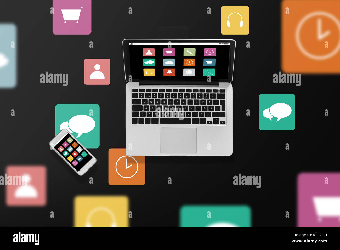 laptop computer with menu icons and smartphone Stock Photo - Alamy