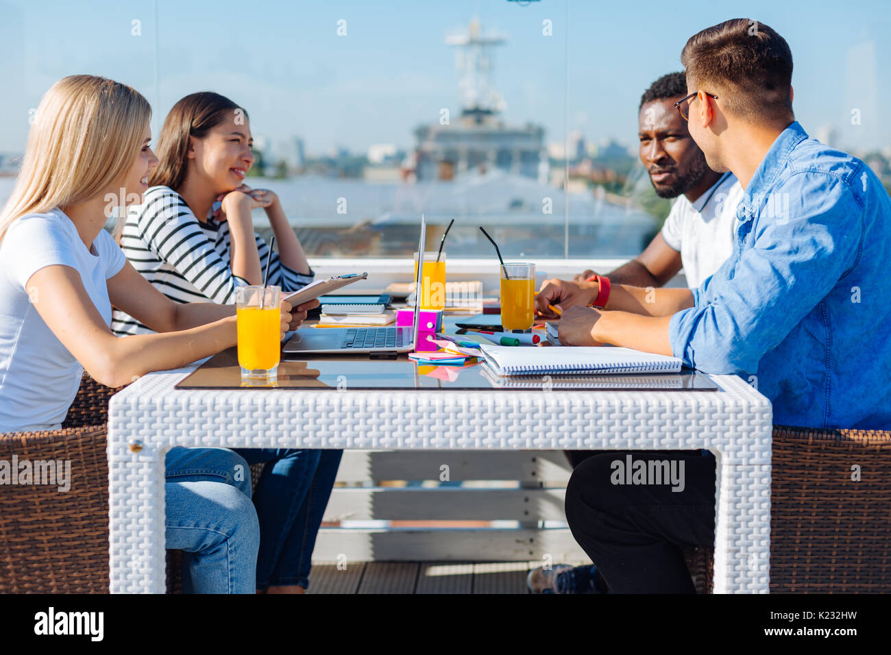 Teamwork in a friendly atmosphere hi-res stock photography and images ...