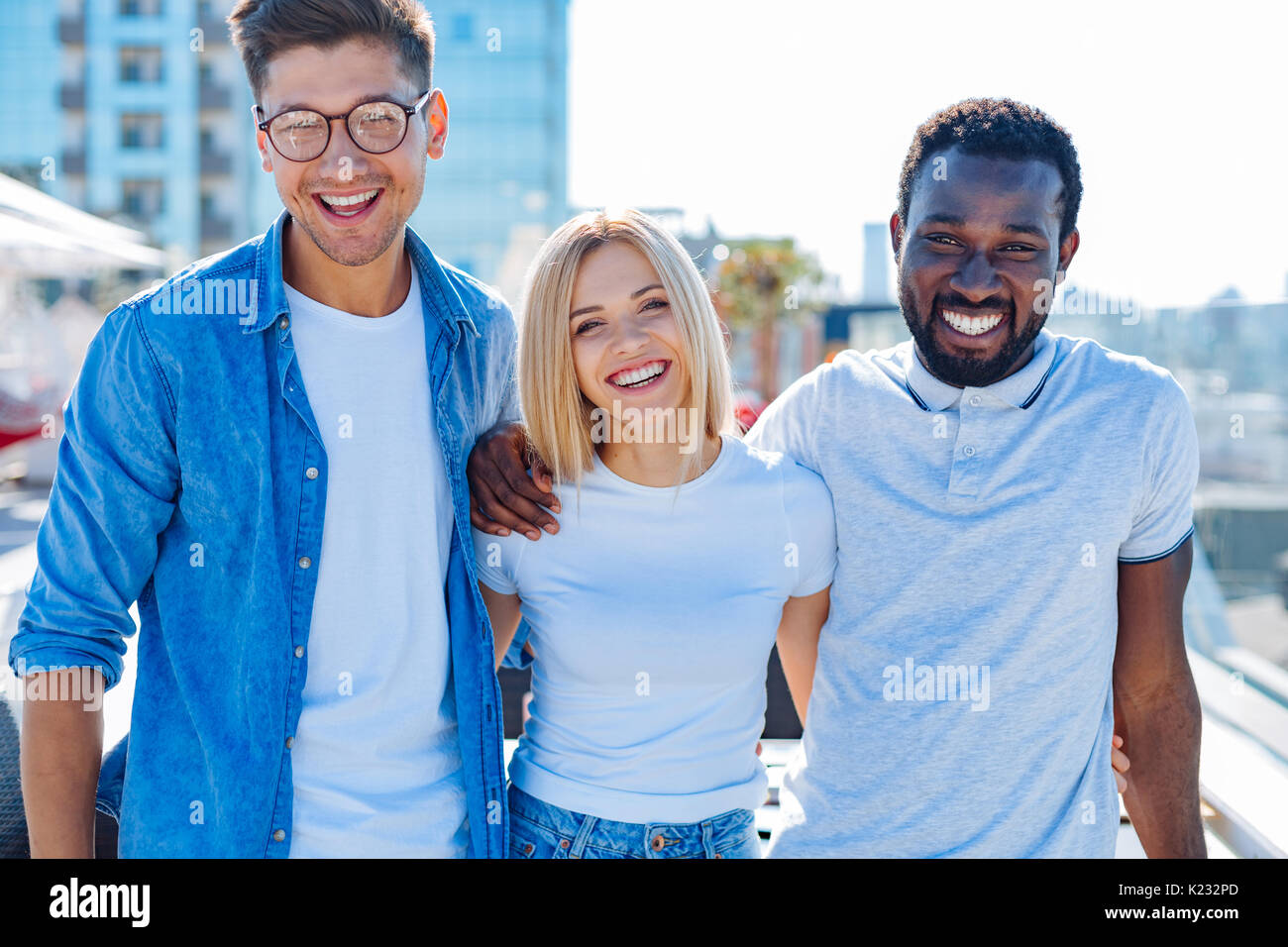 Radiant international friends posing for photo Stock Photo - Alamy