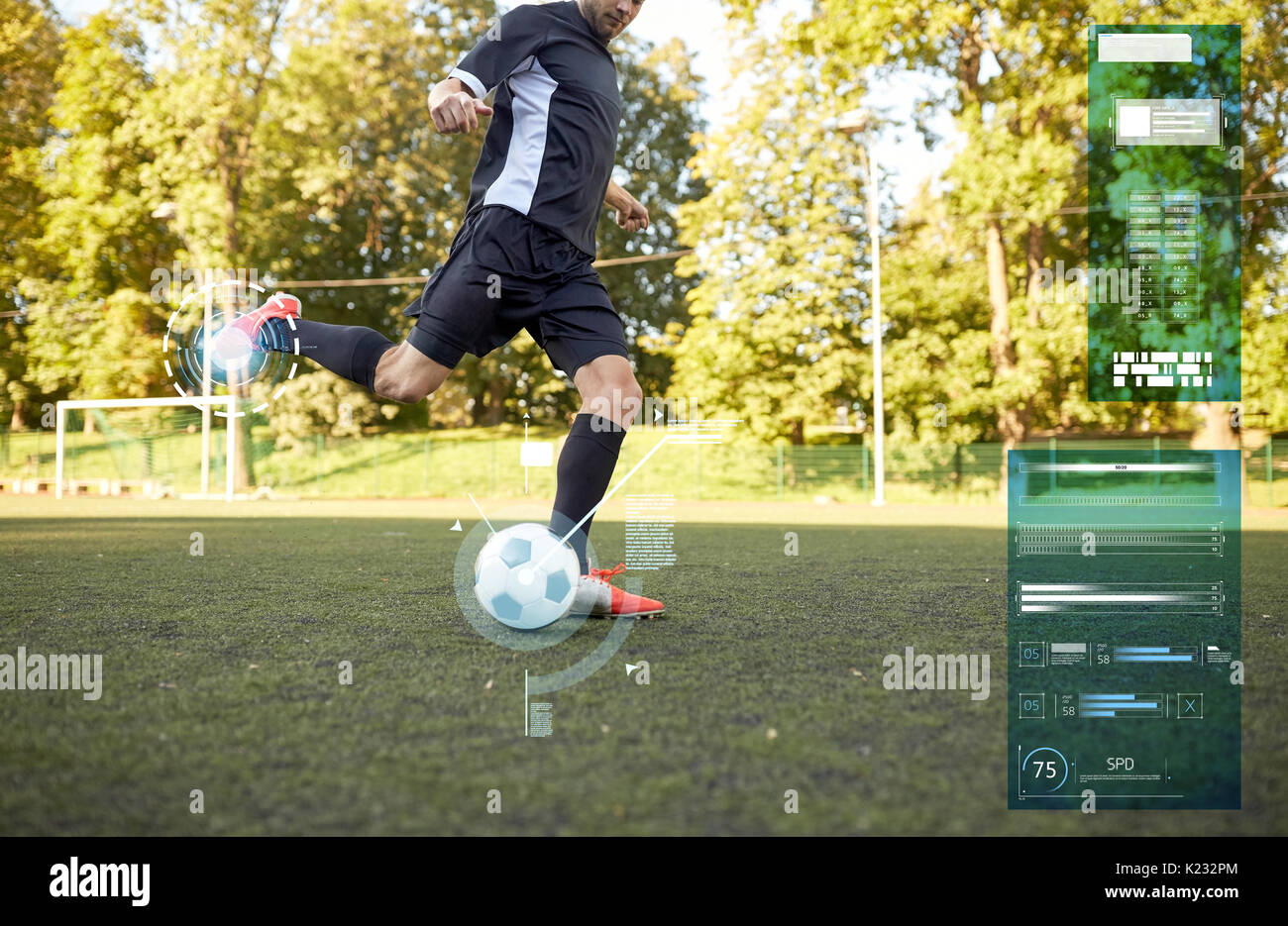 soccer player playing with ball on football field Stock Photo - Alamy