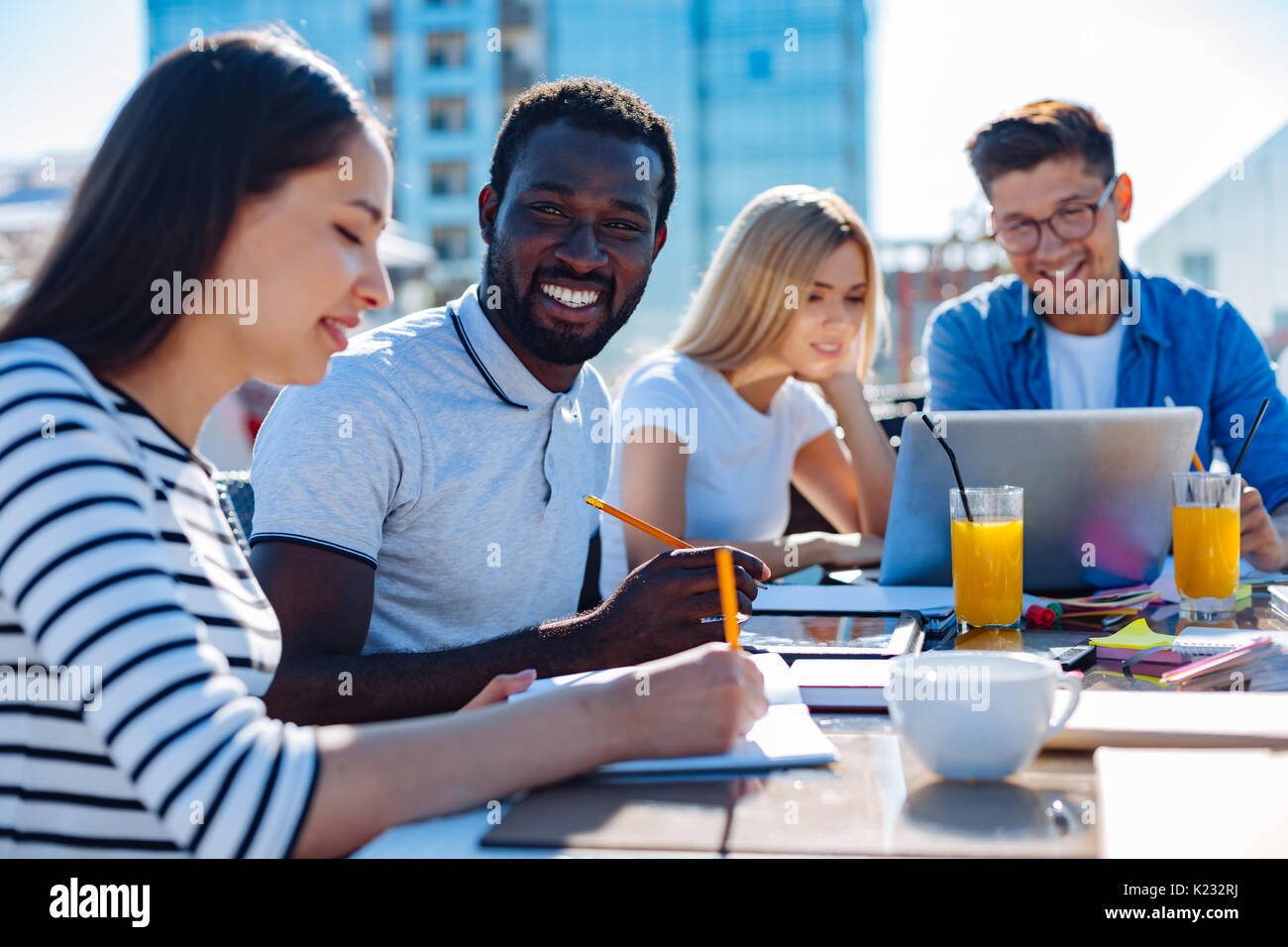 College students doing home assignment outdoors Stock Photo - Alamy