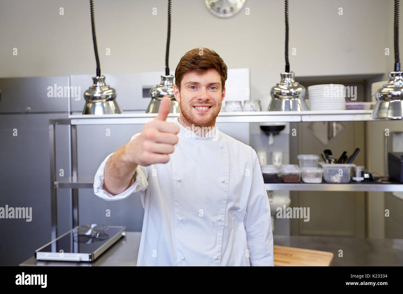 Handsome cooking chef showing hi-res stock photography and images - Alamy