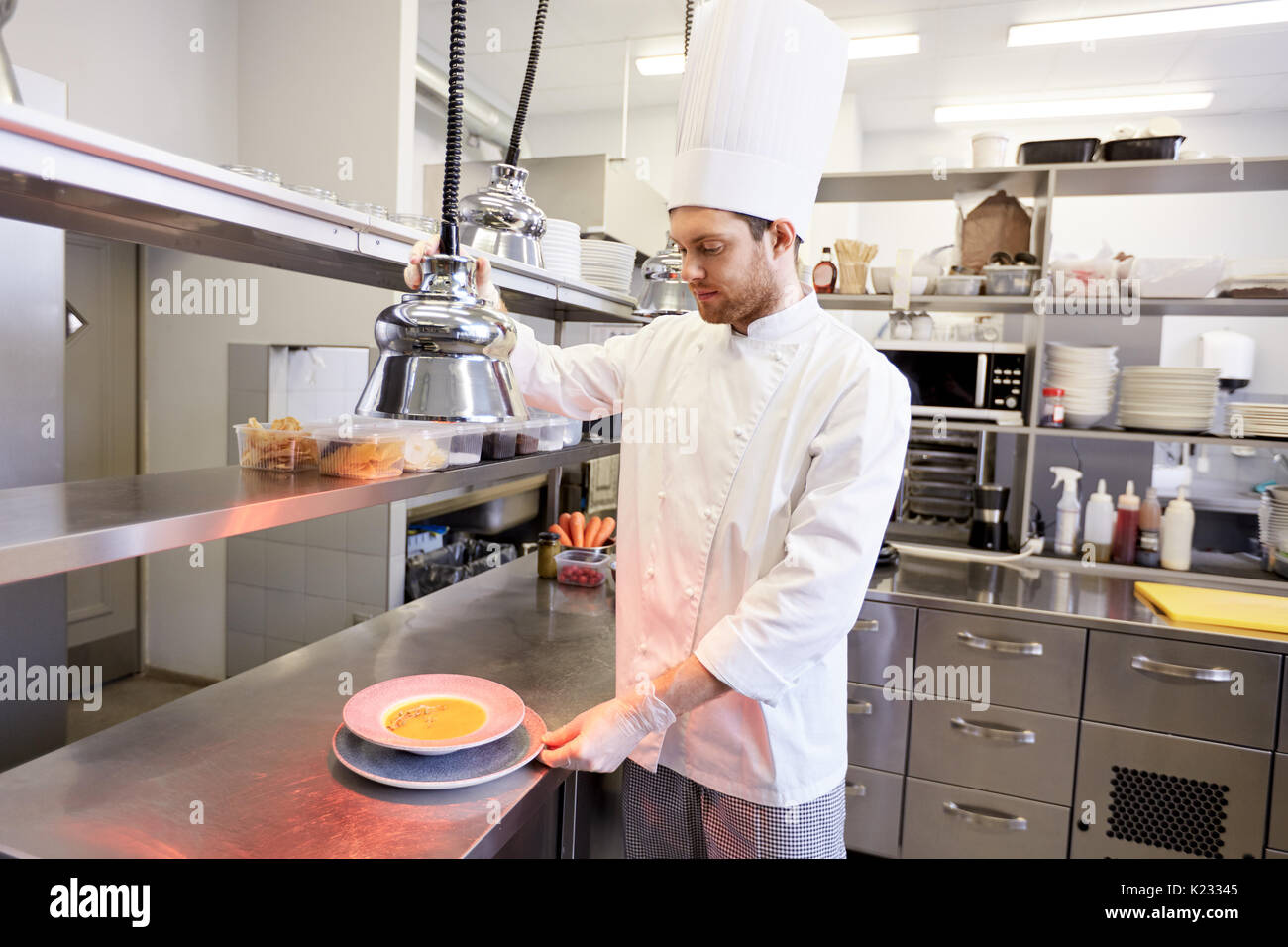 happy male chef cooking food at restaurant kitchen Stock Photo - Alamy