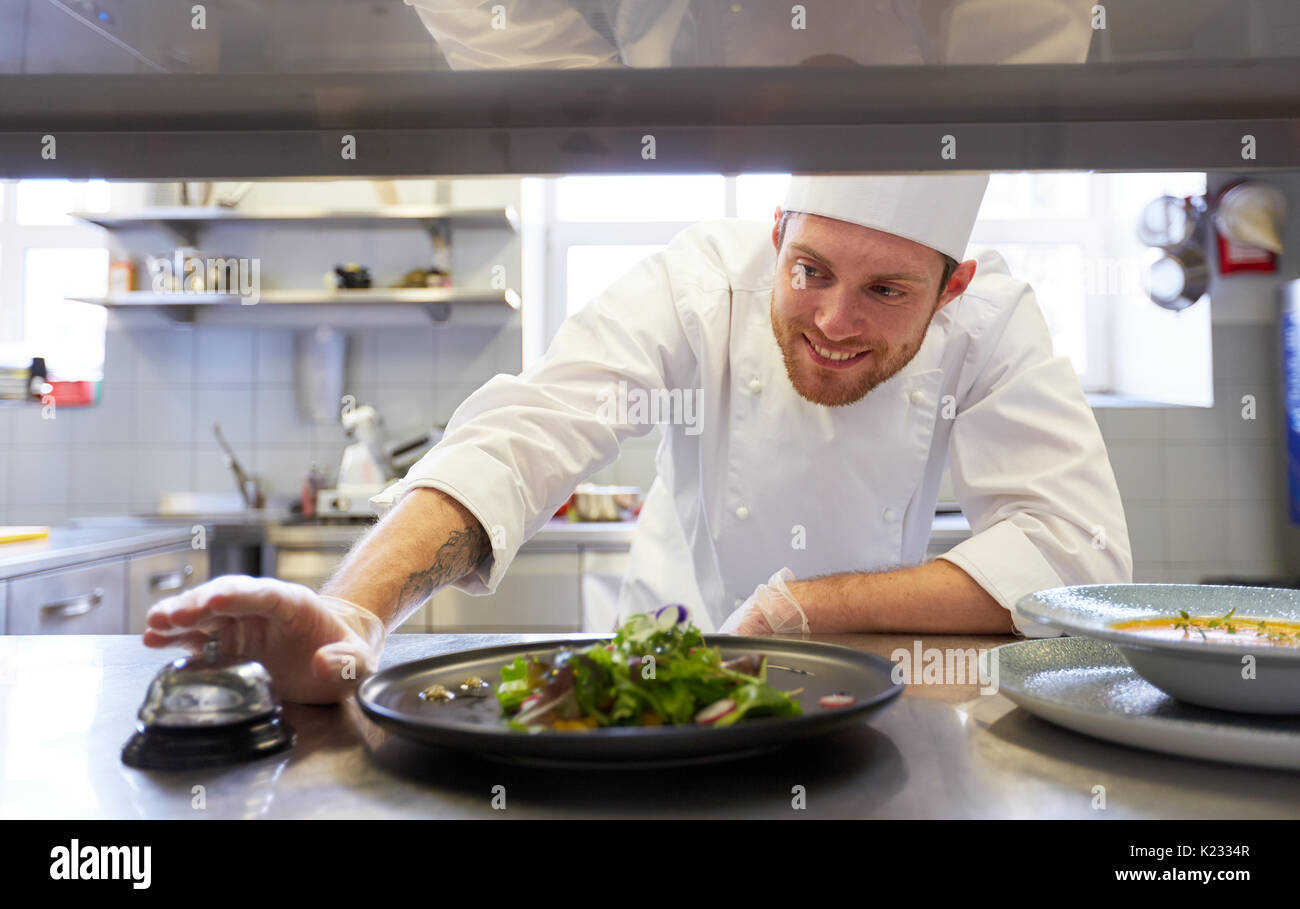 happy male chef cooking food at restaurant kitchen Stock Photo - Alamy