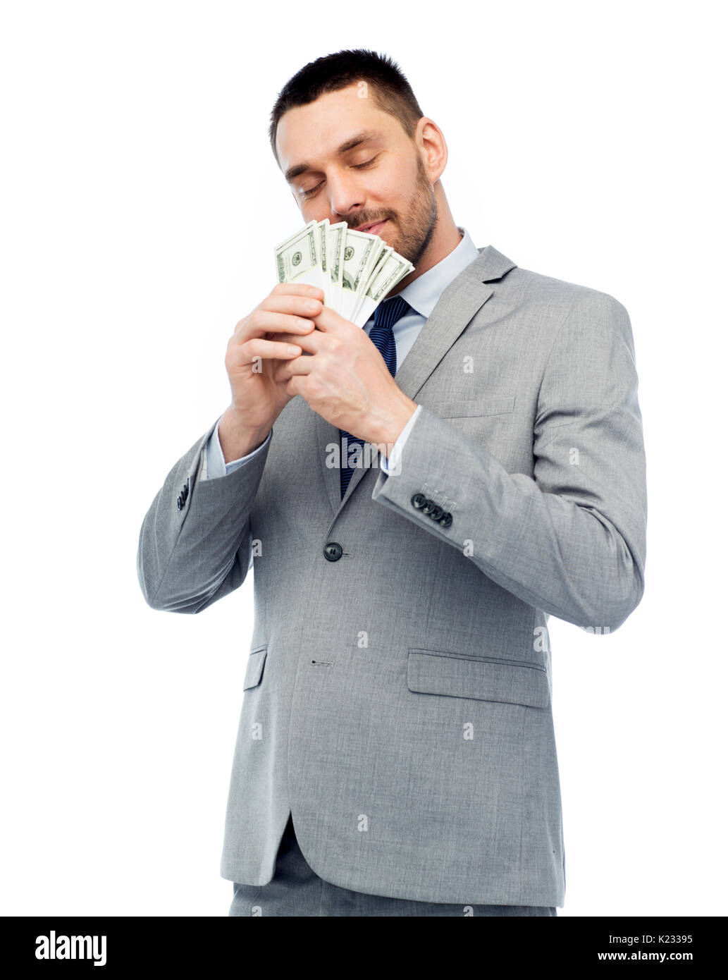 businessman smelling american dollar money Stock Photo - Alamy