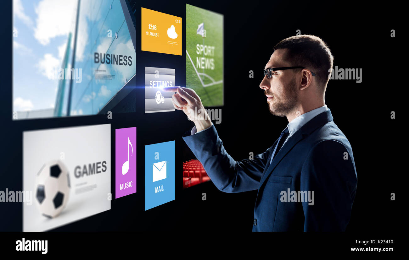 businessman with applications on virtual screen Stock Photo - Alamy