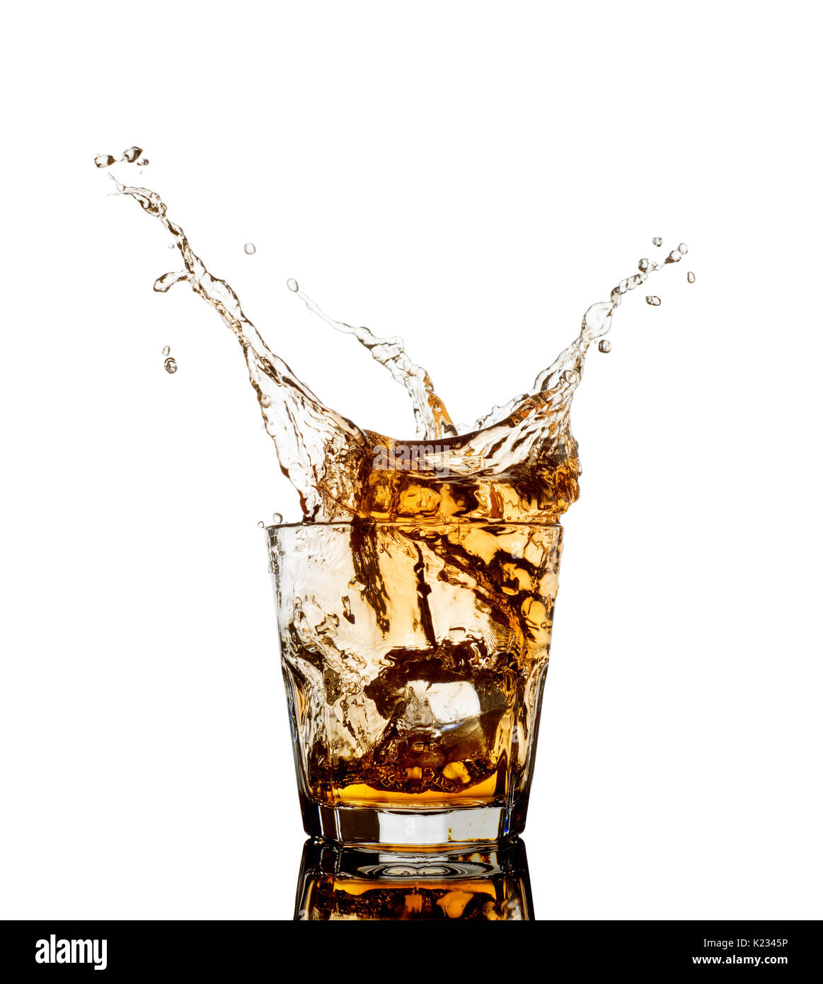 Whiskey splash out of glass isolated on white background Stock Photo ...