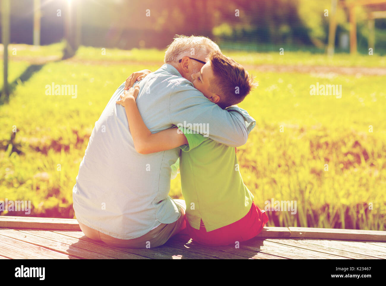 grandfather and grandson hugging on berth Stock Photo - Alamy