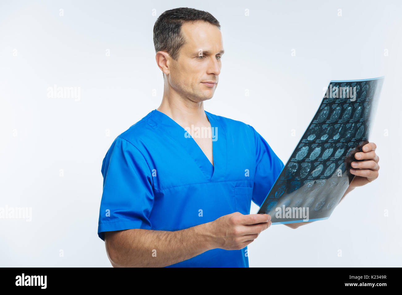 Medical professional looking at mri scan over background Stock Photo ...