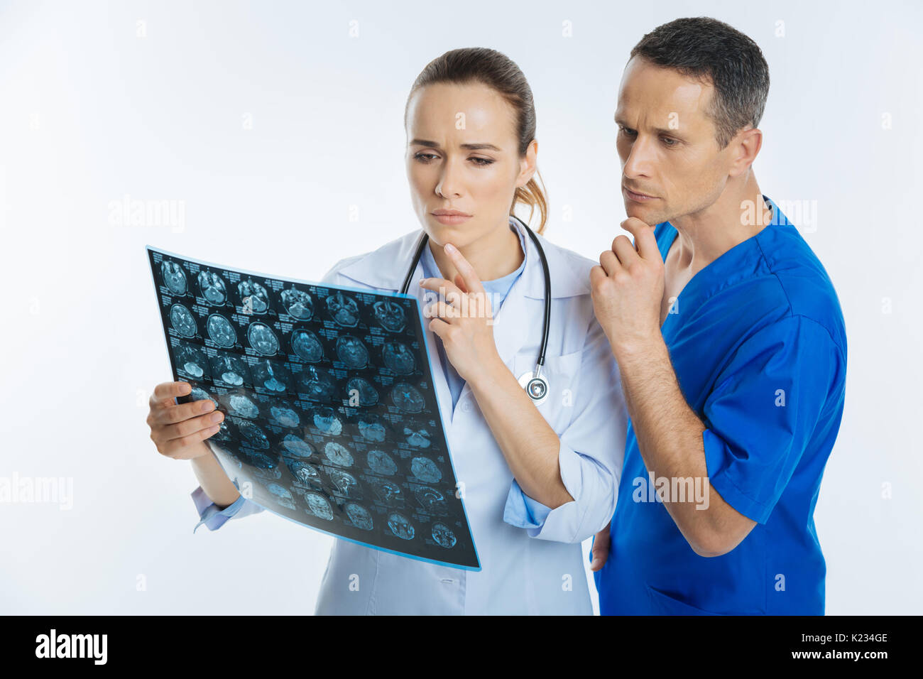 Pensive medical professionals thinking over mri scan picture Stock ...