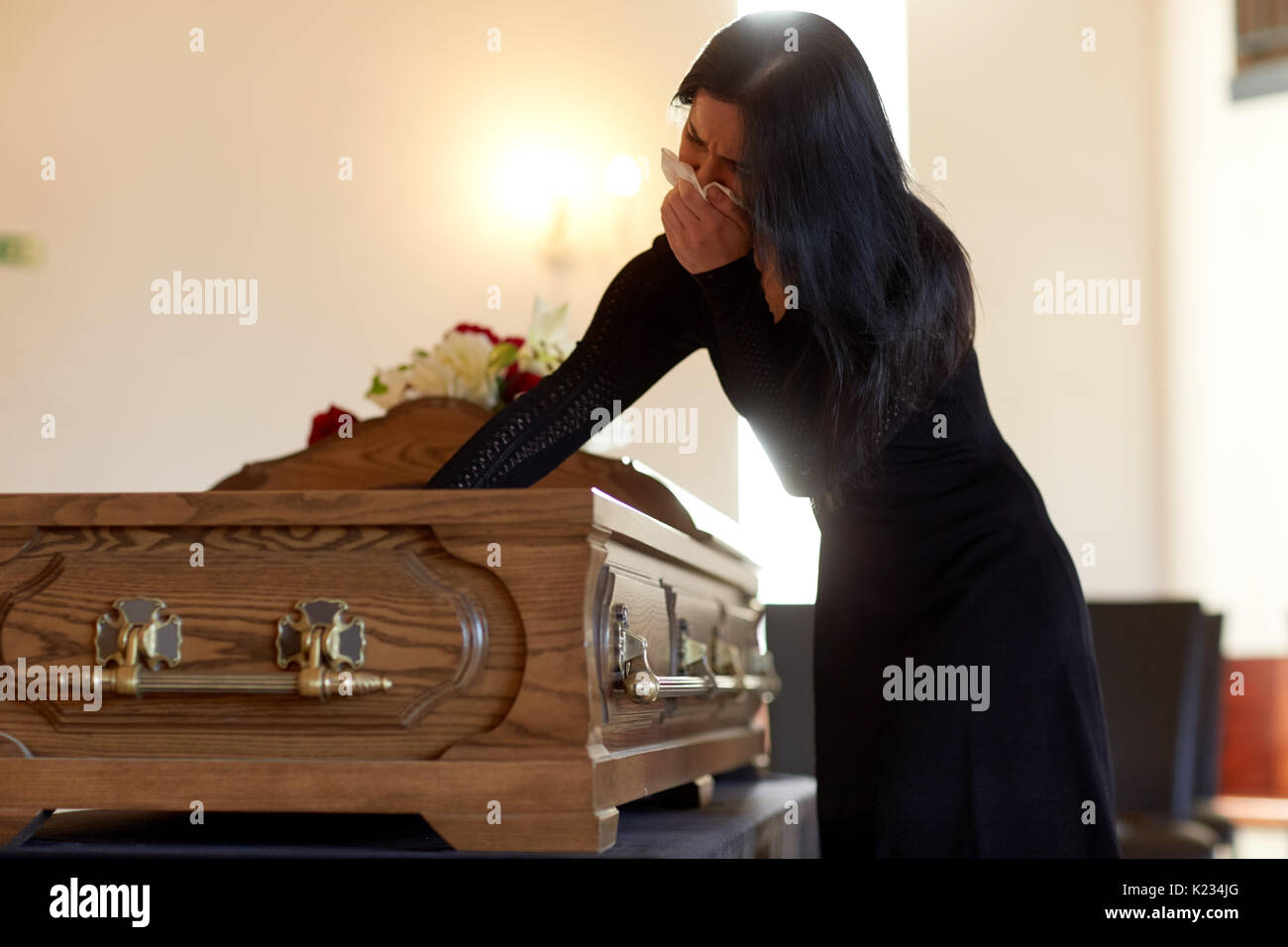 woman with coffin crying at funeral in church Stock Photo - Alamy
