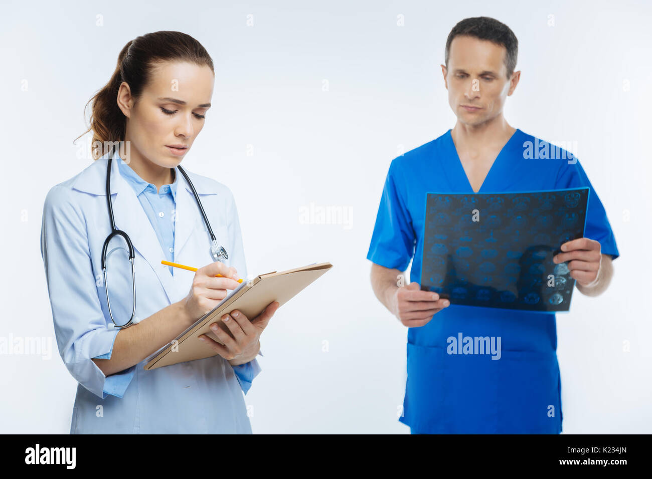 Medical workers working in team together Stock Photo - Alamy