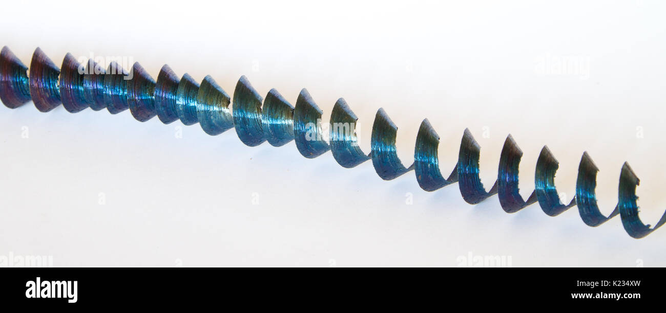 A beautiful metal strand on a light background. Metalworks details ...