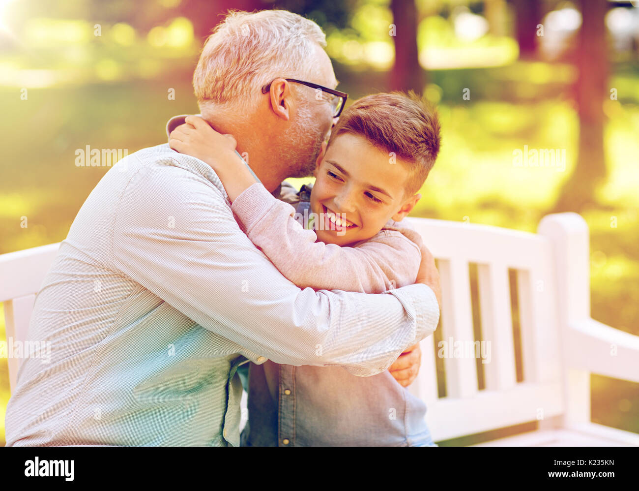grandfather and grandson hugging at summer park Stock Photo - Alamy